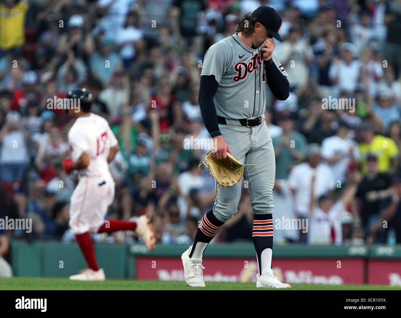 Boston Red Sox's David Hamilton, back left, rounds third base after ...