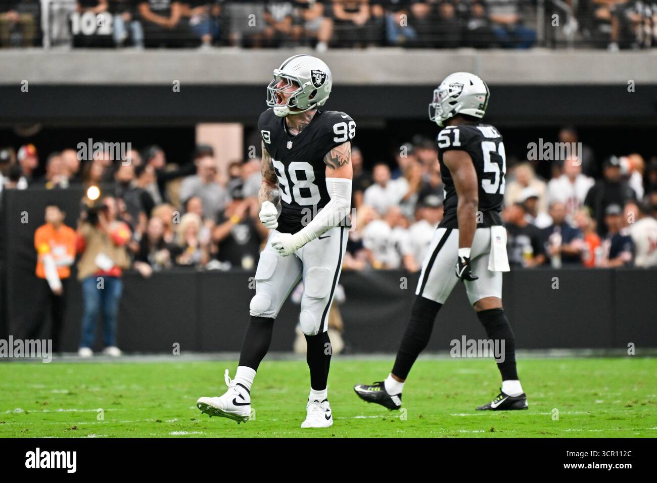 Las Vegas Raiders defensive end Maxx Crosby (98) reacts to a play ...
