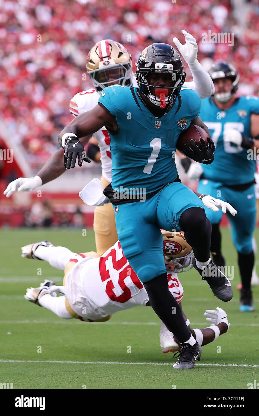 Jacksonville Jaguars running back Travis Etienne Jr. (1) runs toward ...