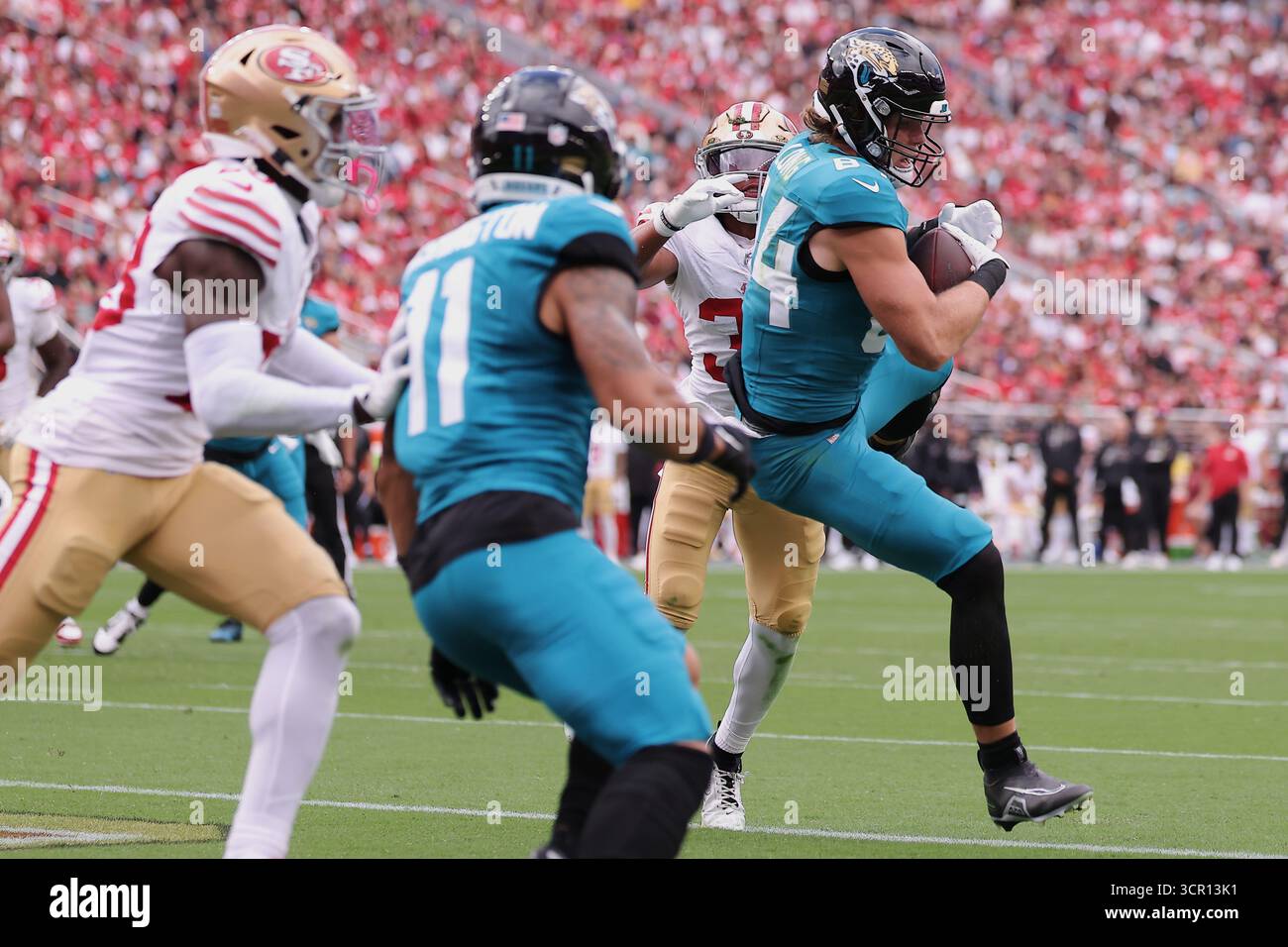 Jacksonville Jaguars tight end Hunter Long, right, catches a touchdown ...