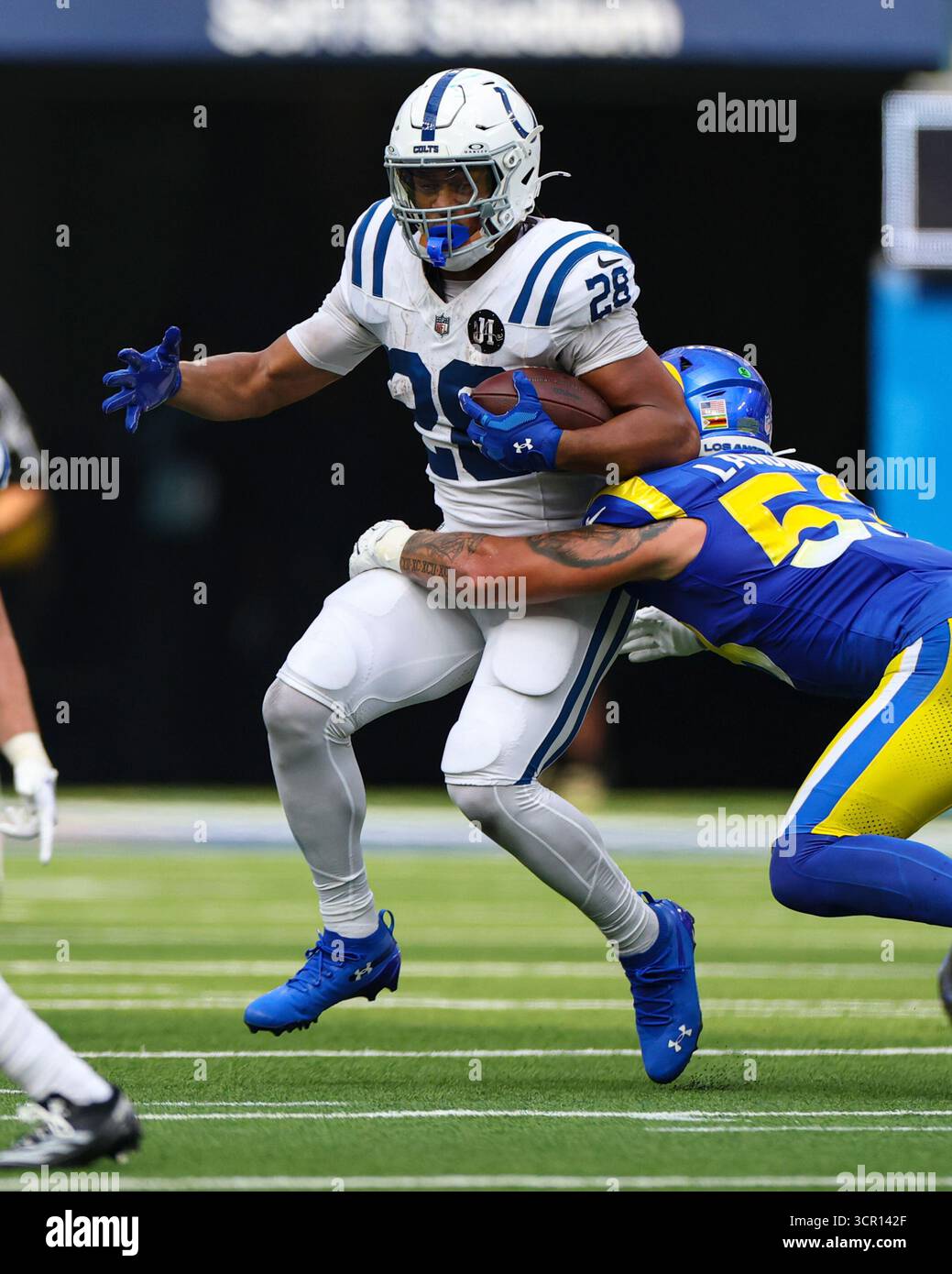 Indianapolis Colts running back Jonathan Taylor (28) is tackled by Los ...