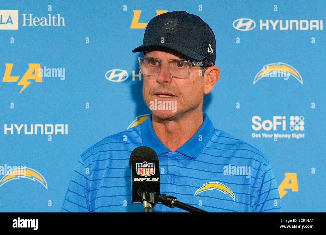 Los Angeles Chargers head coach Jim Harbaugh answers questions during a ...