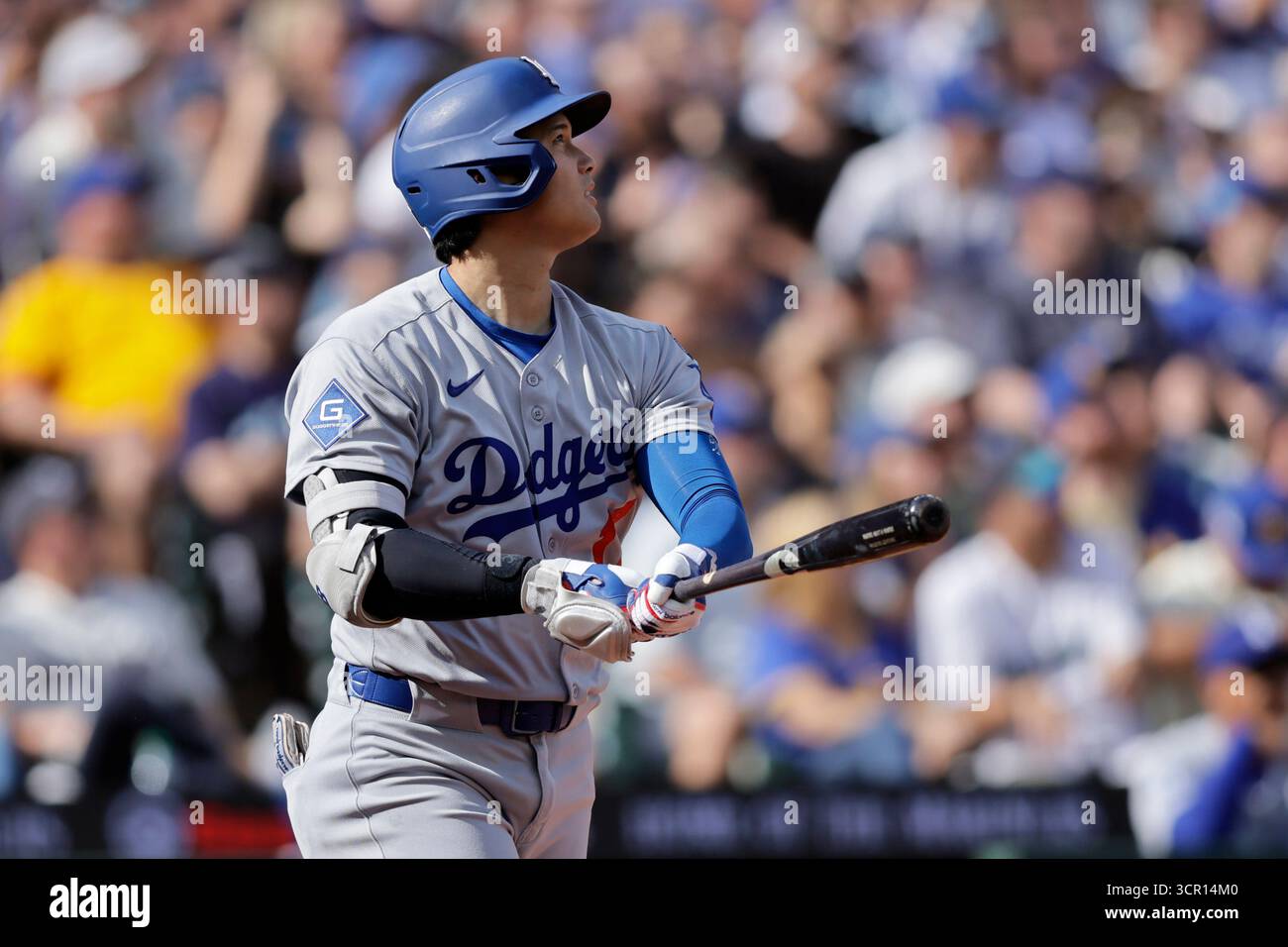 Los Angeles Dodgers' Shohei Ohtani watches his solo home run off ...