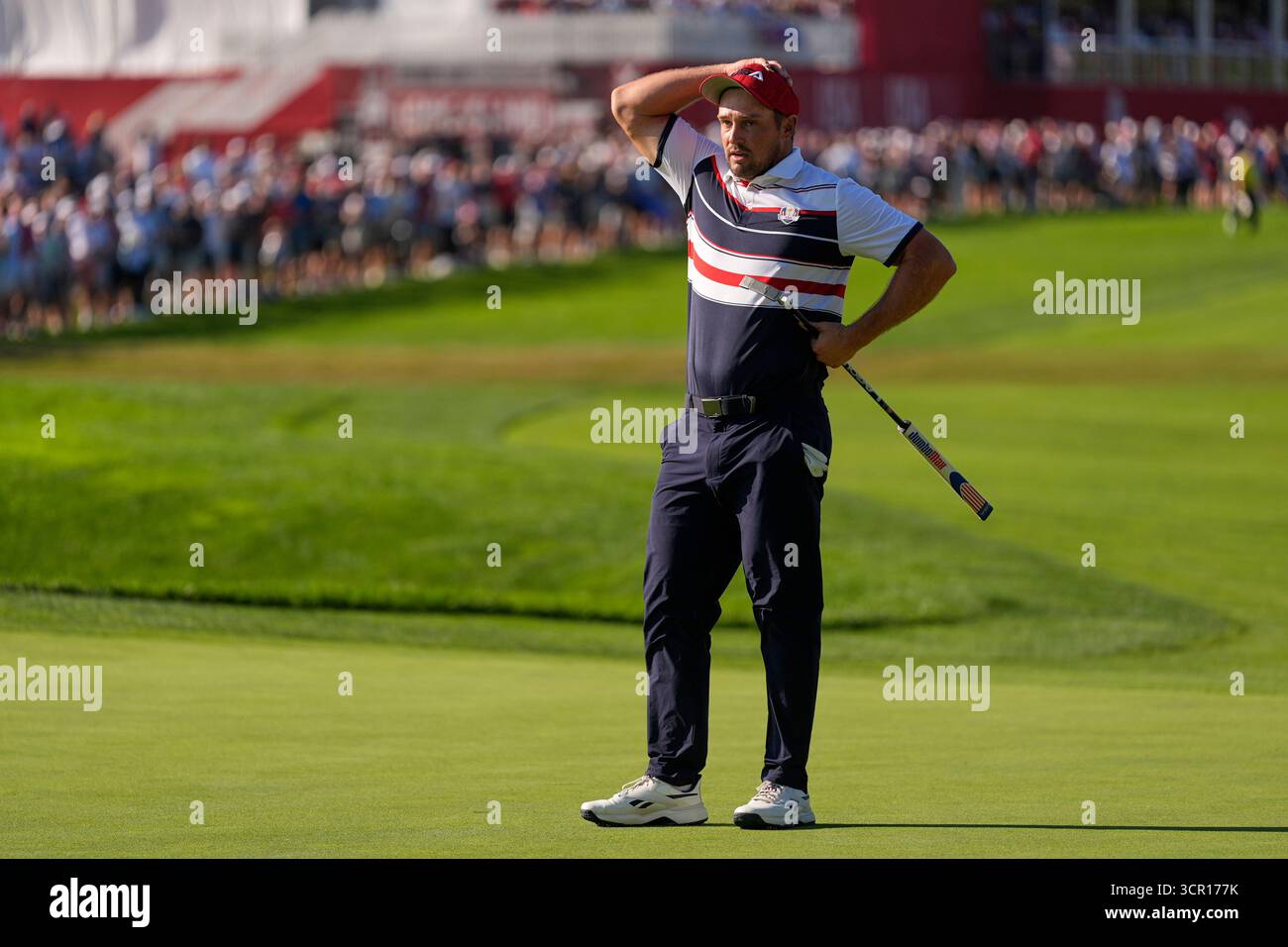 United States' Bryson DeChambeau reacts after missing a putt on the ...