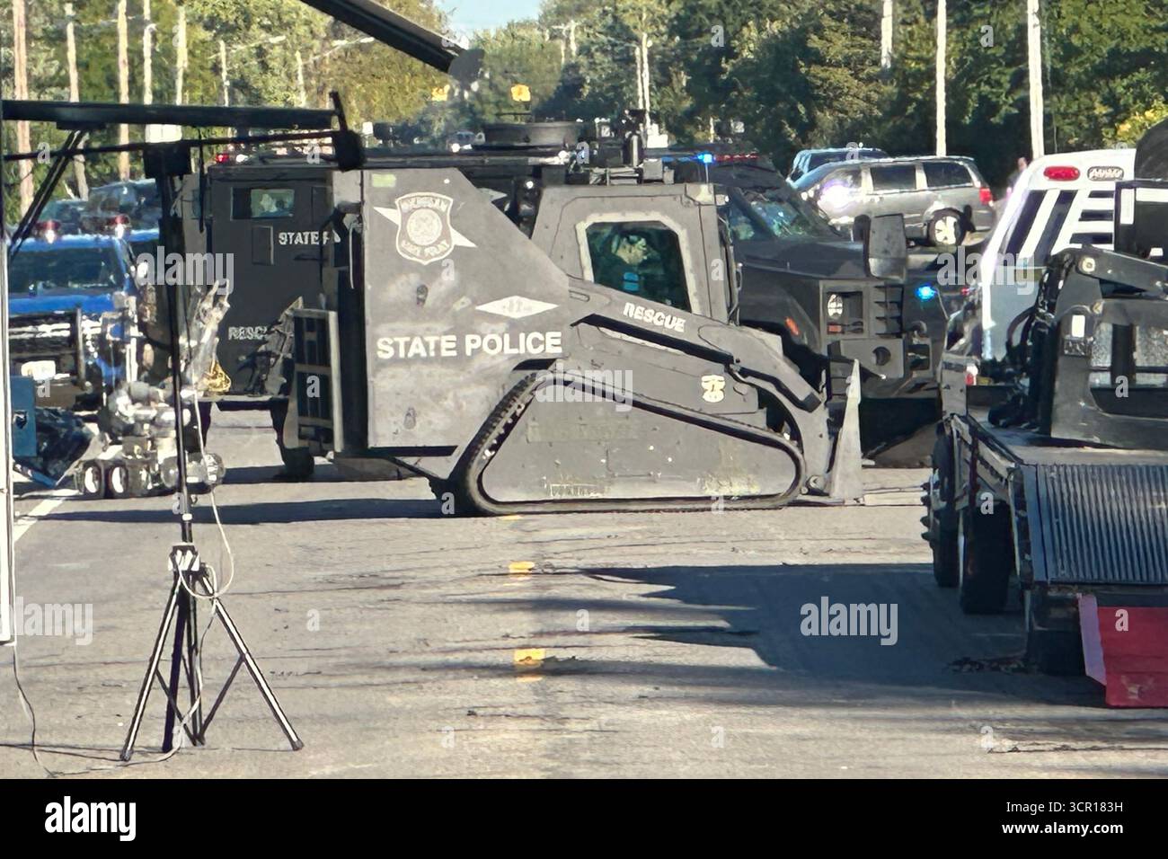 A police battering ram vehicle is positioned outside the home of the ...