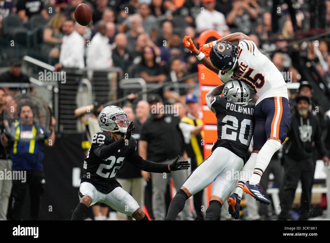 Chicago Bears wide receiver Rome Odunze (15) misses a pass as he is tackled by Las Vegas Raiders ...