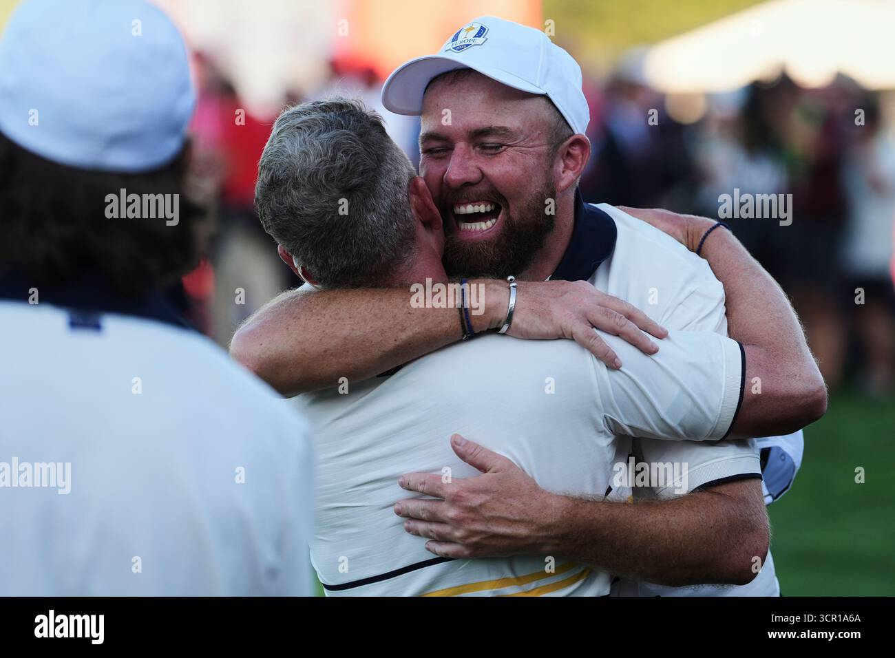 Europe's Shane Lowry celebrates with captain Luke Donald after making ...