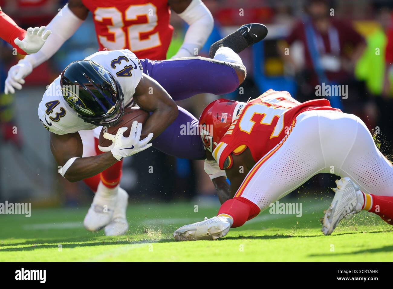 Baltimore Ravens running back Justice Hill (43) is tackled by Kansas ...