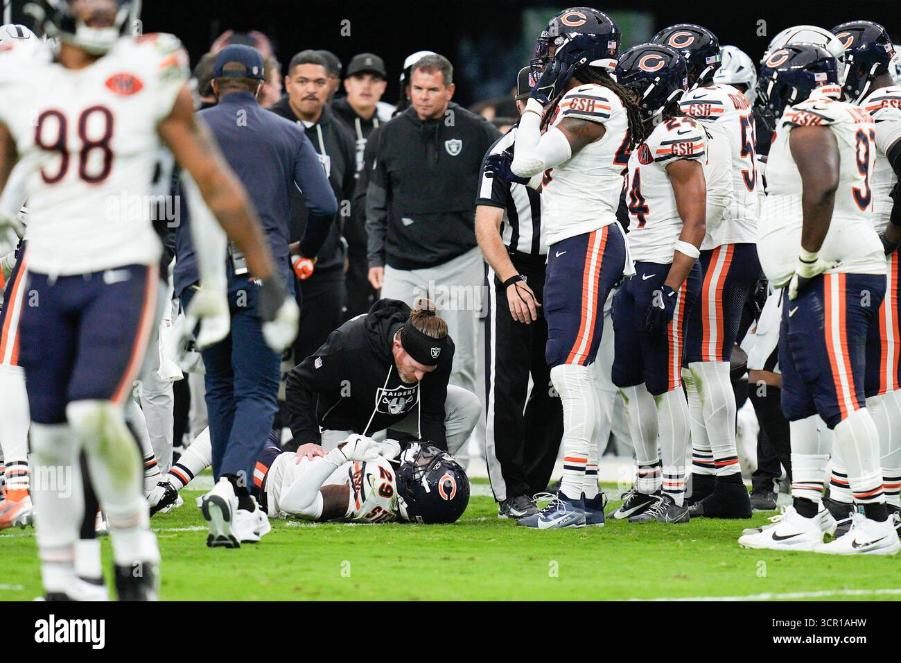 Chicago Bears cornerback Tyrique Stevenson (29) is checked on by a ...