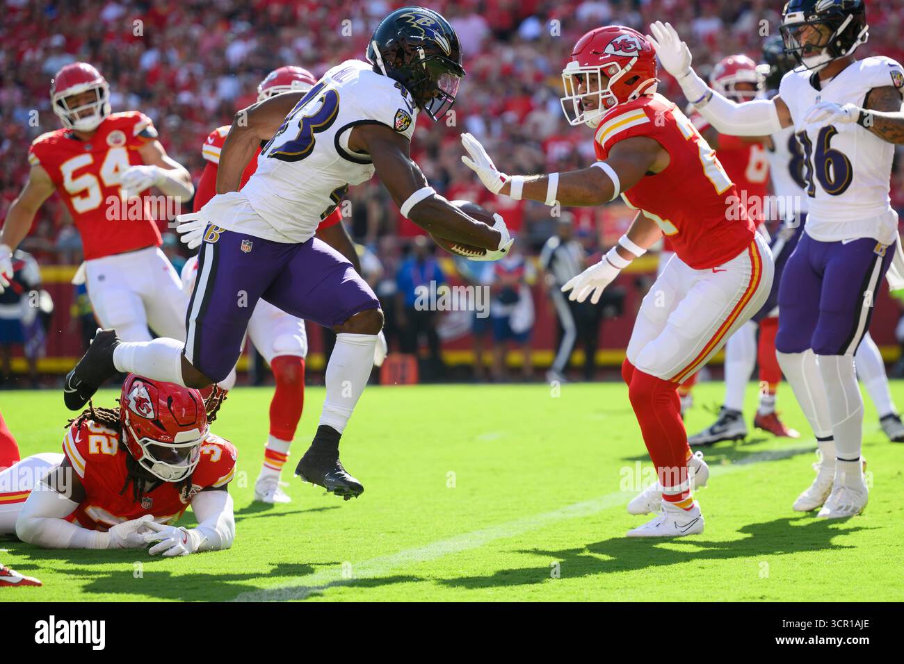 Baltimore Ravens running back Justice Hill (43) runs through the Kansas ...