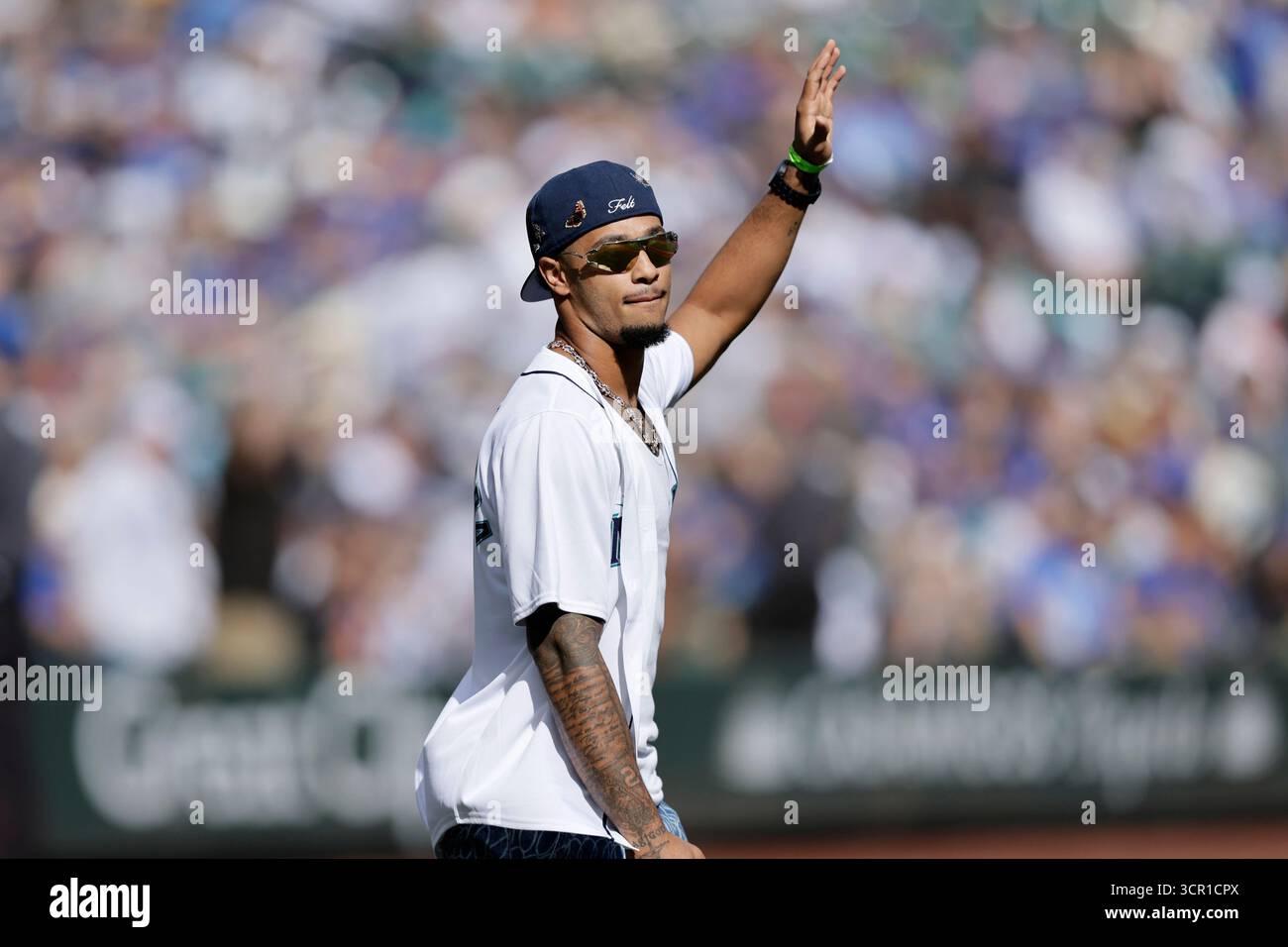 Seattle Seahawks' Jaxon Simith-Njigba waves before throwing out the ...