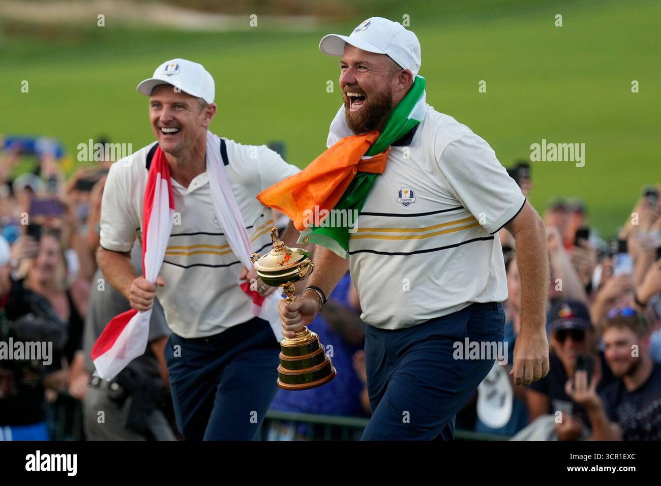 Europe's Shane Lowry and Justin Rose celebrate with the trophy after ...
