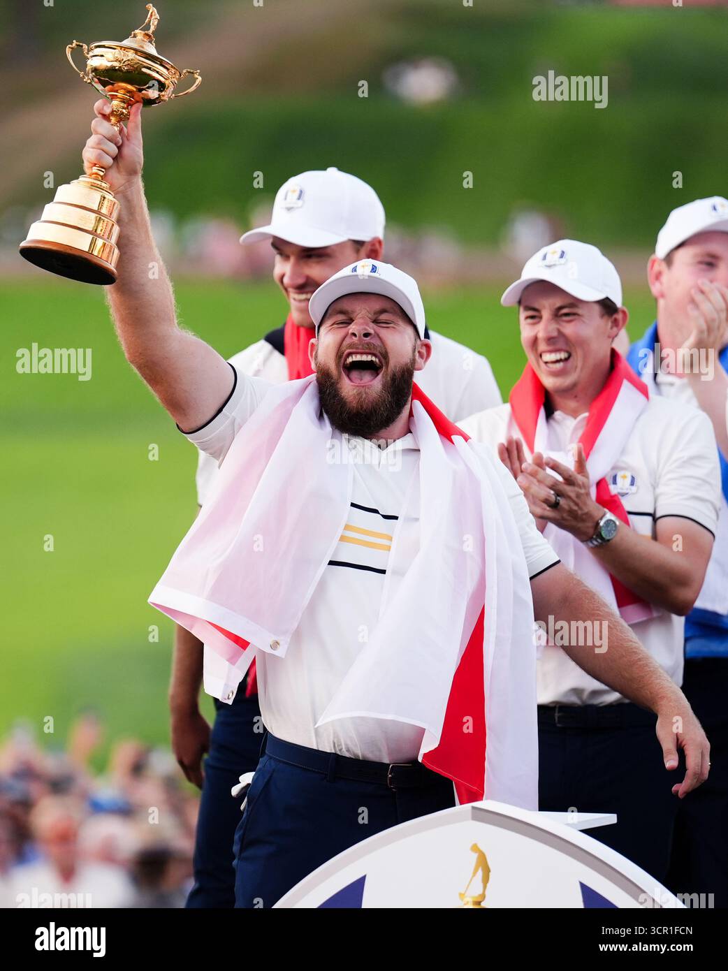 Tyrrell Hatton of Team Europe celebrates with the Ryder Cup Trophy on ...