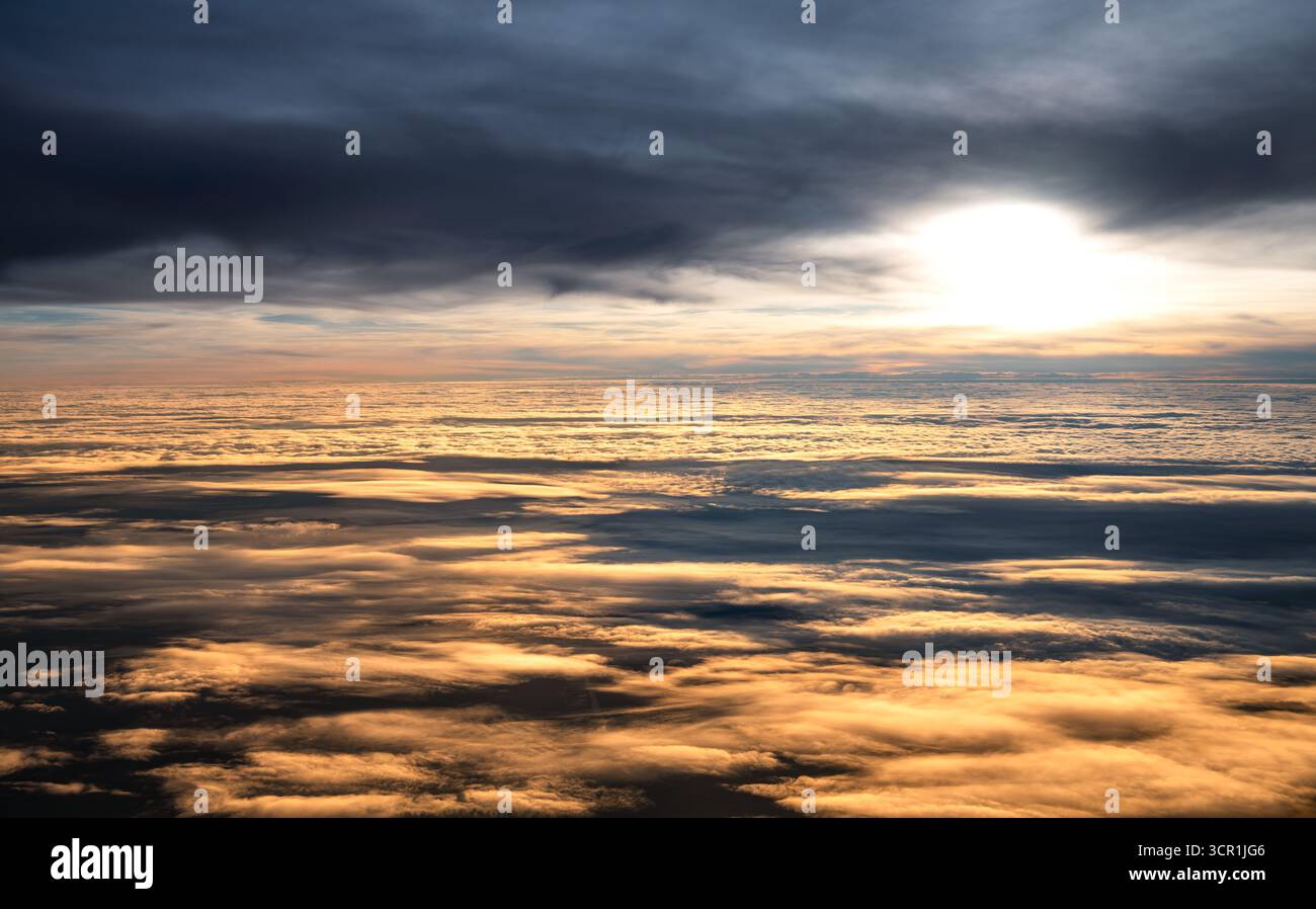 Sunlight Breaking Through Layers of Clouds in Flight Stock Photo - Alamy
