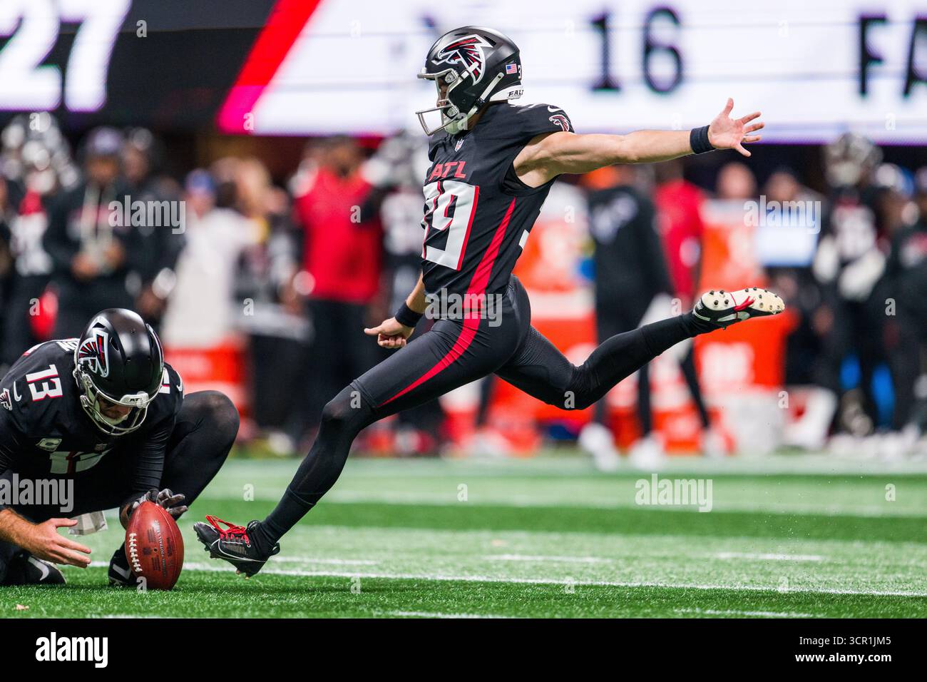 Atlanta Falcons cornerback Keith Taylor (39) kicks an extra point ...