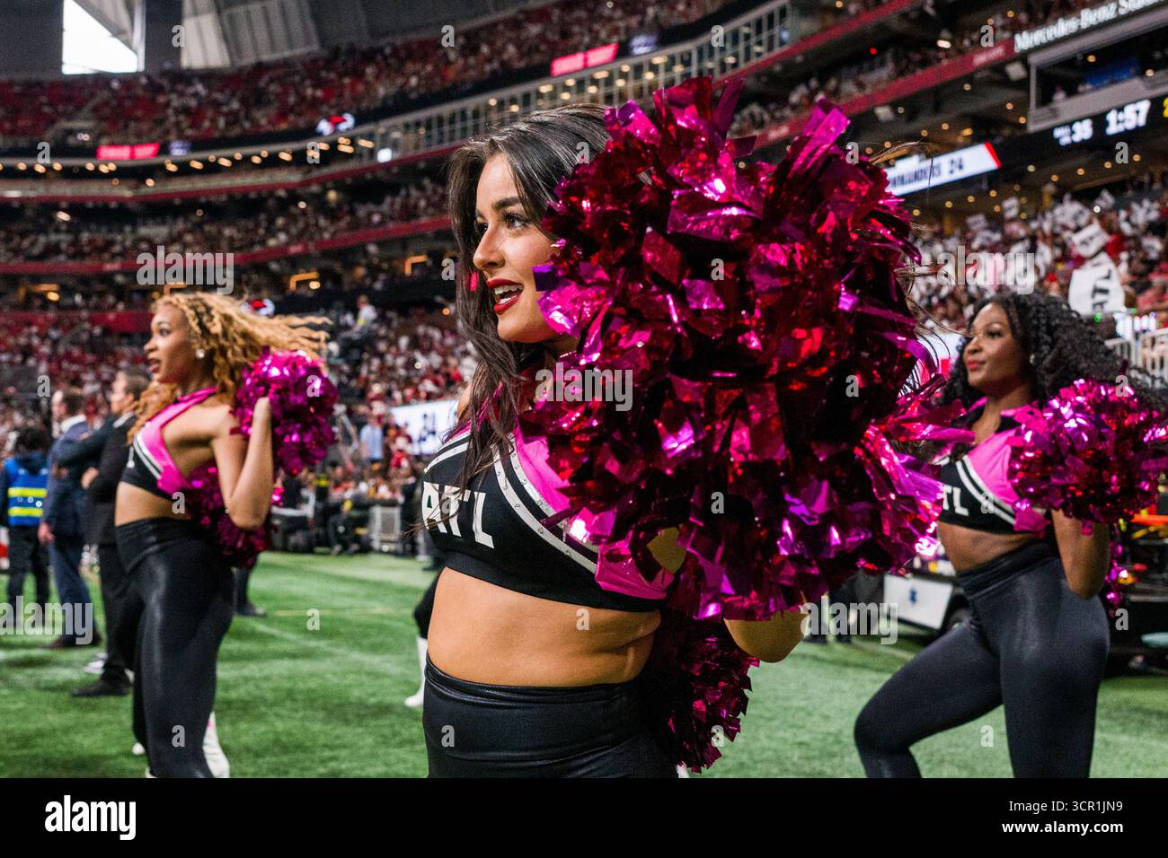 An Atlanta Falcons cheerleader performs during the second half of an ...