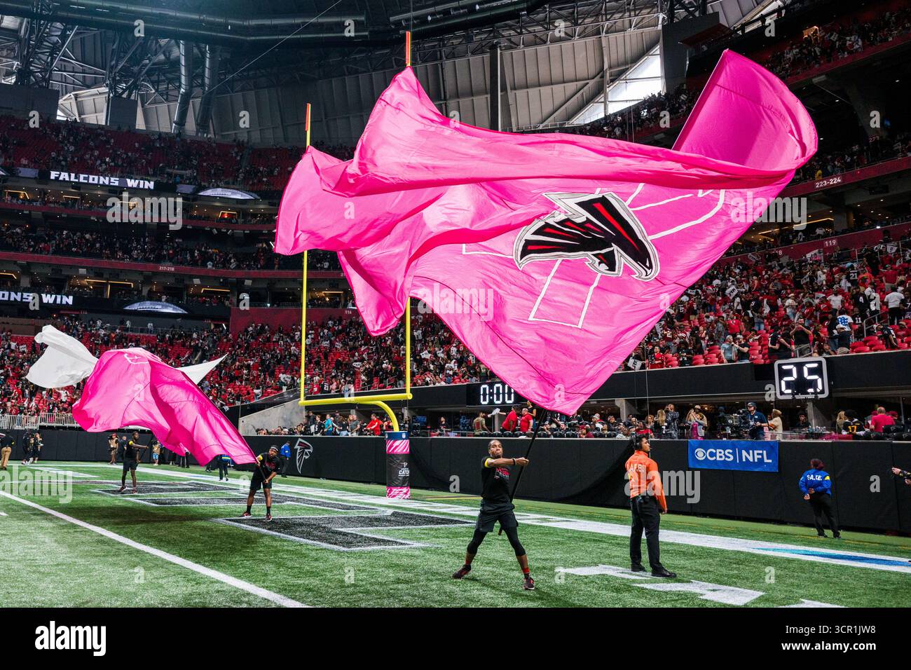 Flags are waved after an NFL football game between the Atlanta Falcons ...