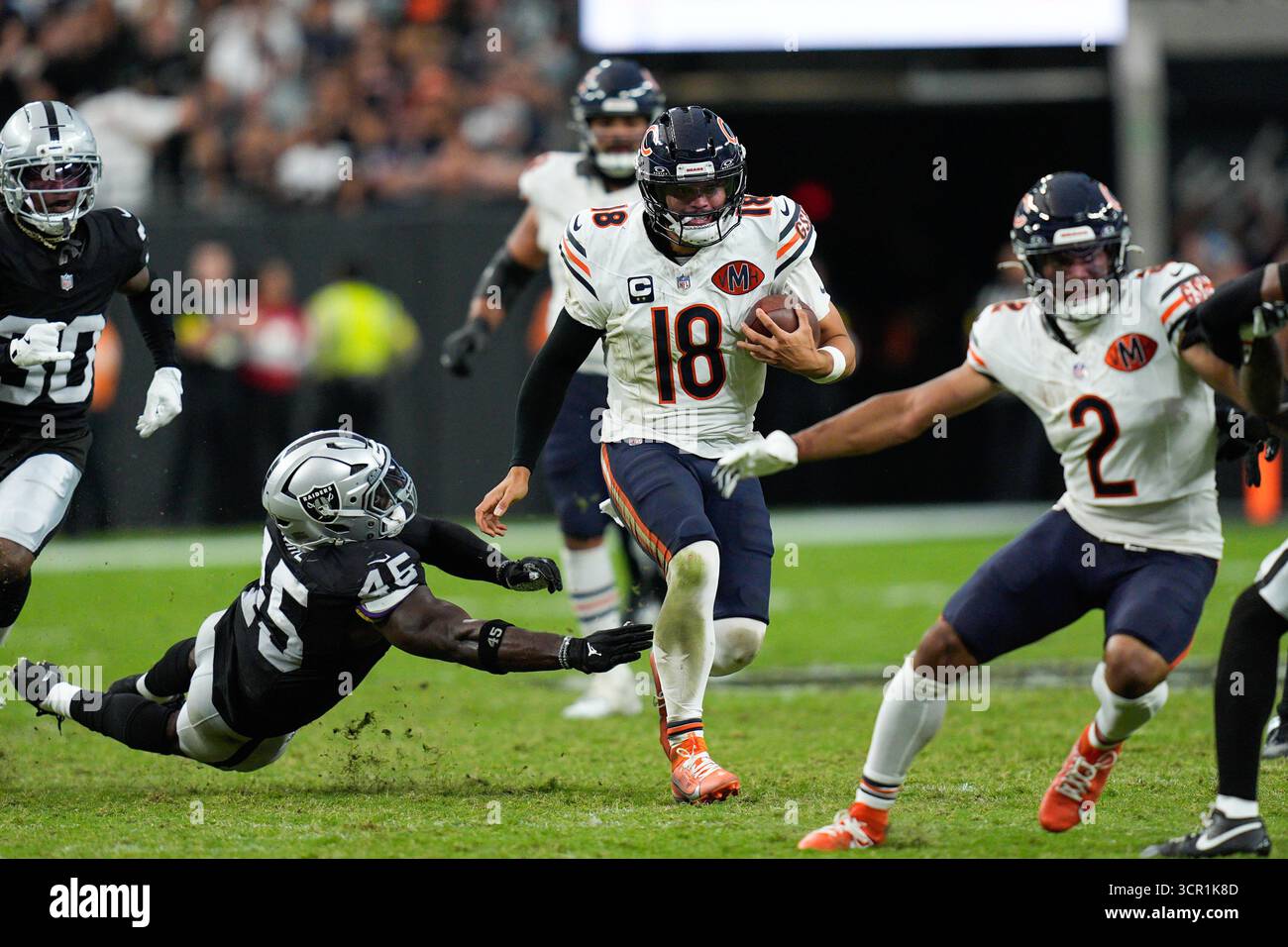 Chicago Bears quarterback Caleb Williams (18) carries the ball past Las ...