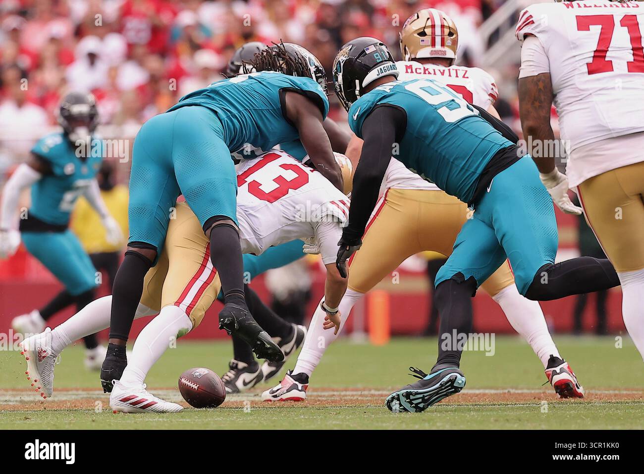 San Francisco 49ers quarterback Brock Purdy (13) fumbles the ball while ...
