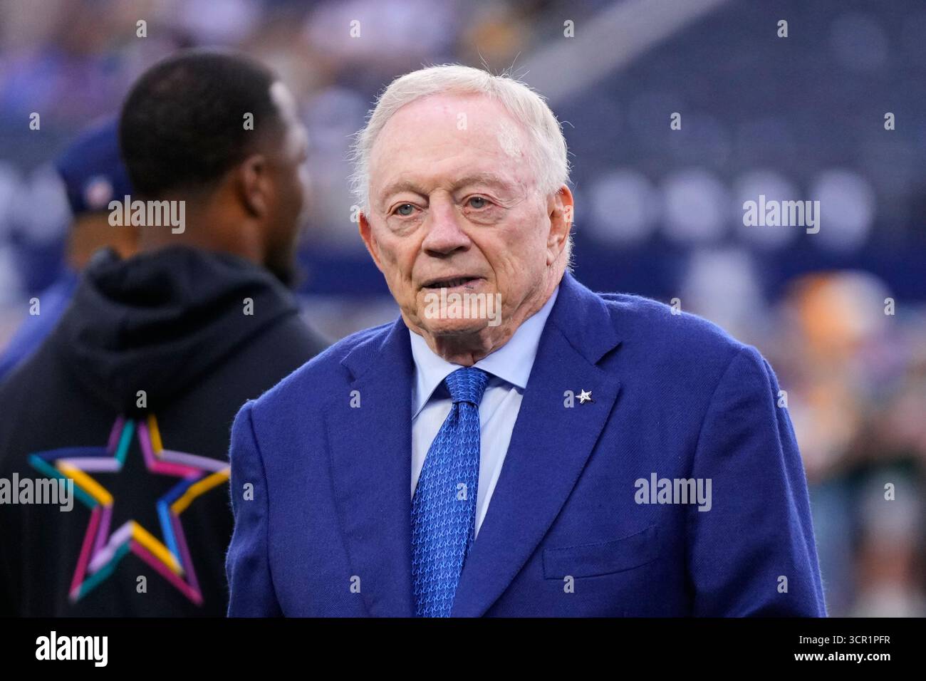Dallas Cowboys team owner Jerry Jones stands on the field before an NFL ...