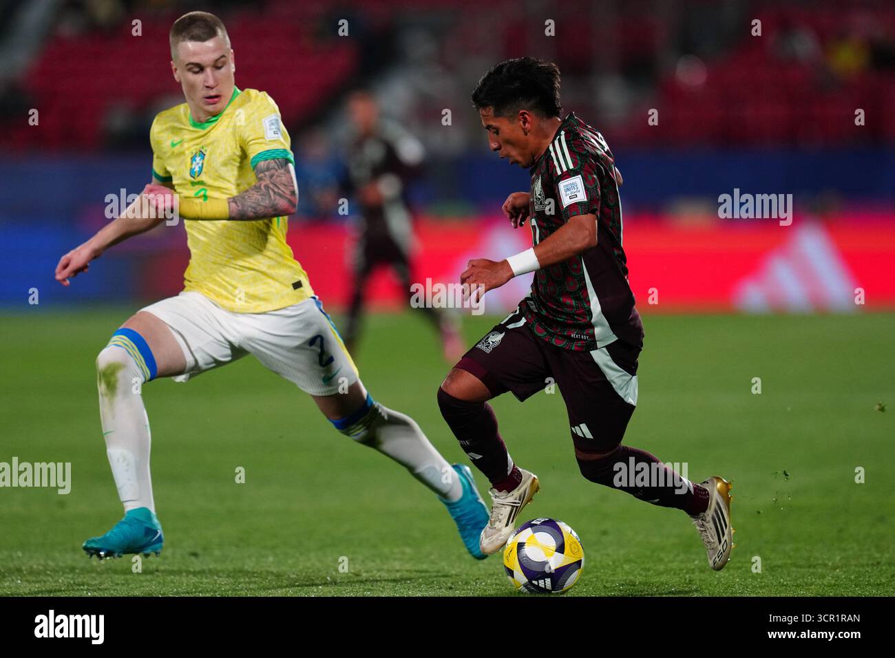 Mexico's Diego Sanchez controls the ball as Brazil's Igor moves in to ...