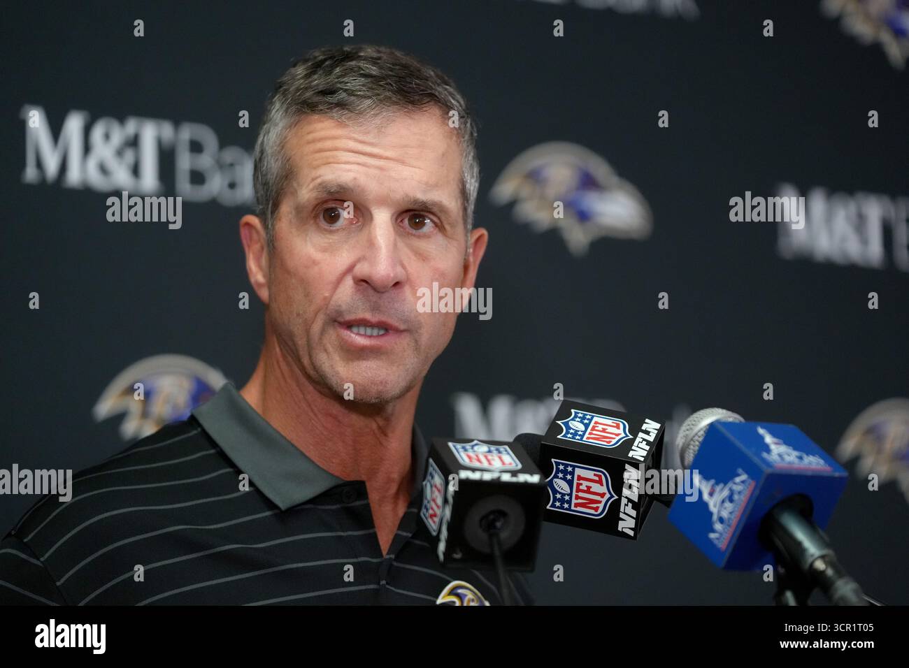 Baltimore Ravens head coach Jim Harbaugh speaks during a news ...