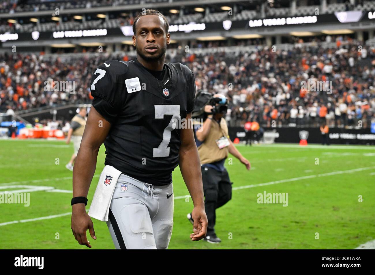 Las Vegas Raiders quarterback Geno Smith (7) leaves the field after an ...