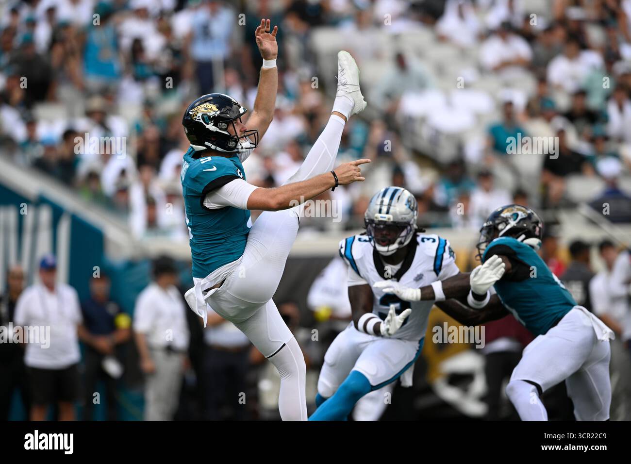 Jacksonville Jaguars punter Logan Cooke (9) watches the flight of the ...