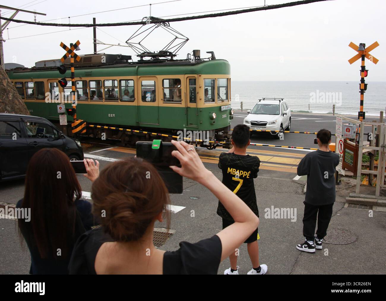A photo shows a railroad crossing associated with the Japanese ...