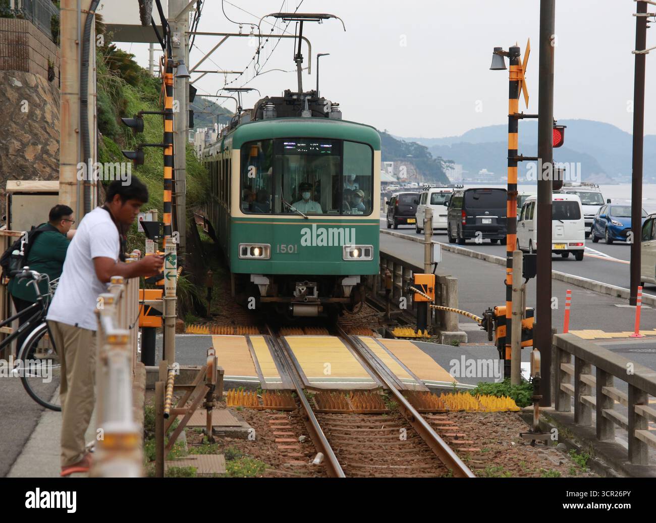 A photo shows a railroad crossing associated with the Japanese ...
