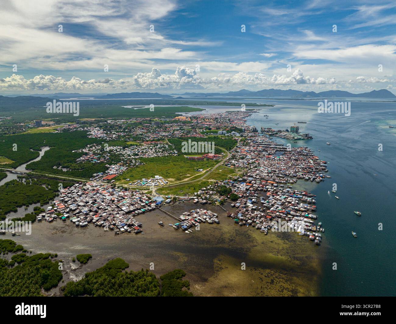 Aerial drone of panorama of the city of Semporna with residential ...