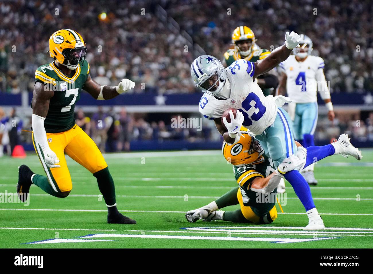 Dallas Cowboys running back Javonte Williams (33) is stopped as he ...