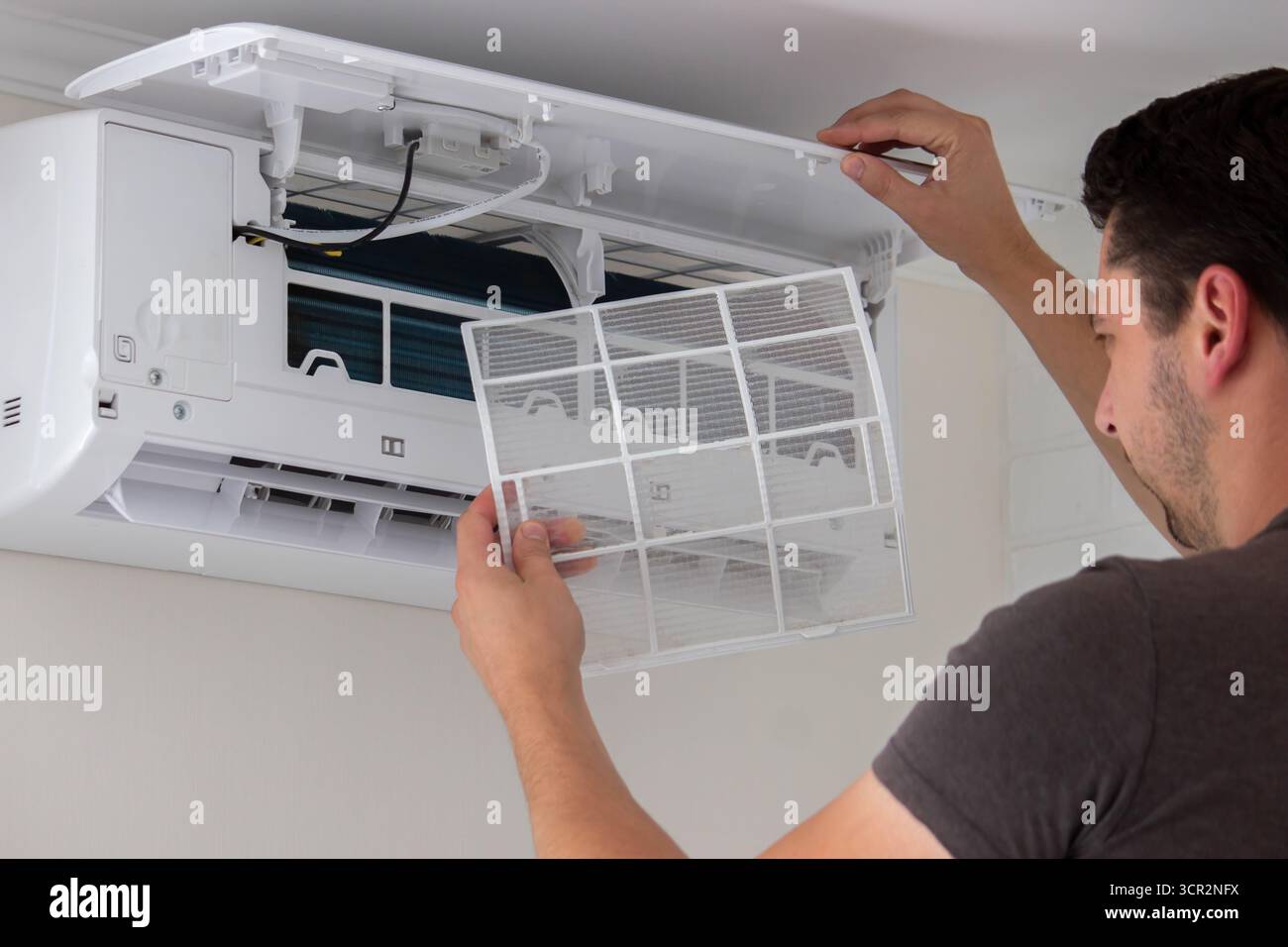 Maintenance Complete. Technician Installing Clean Air Filter in Air ...