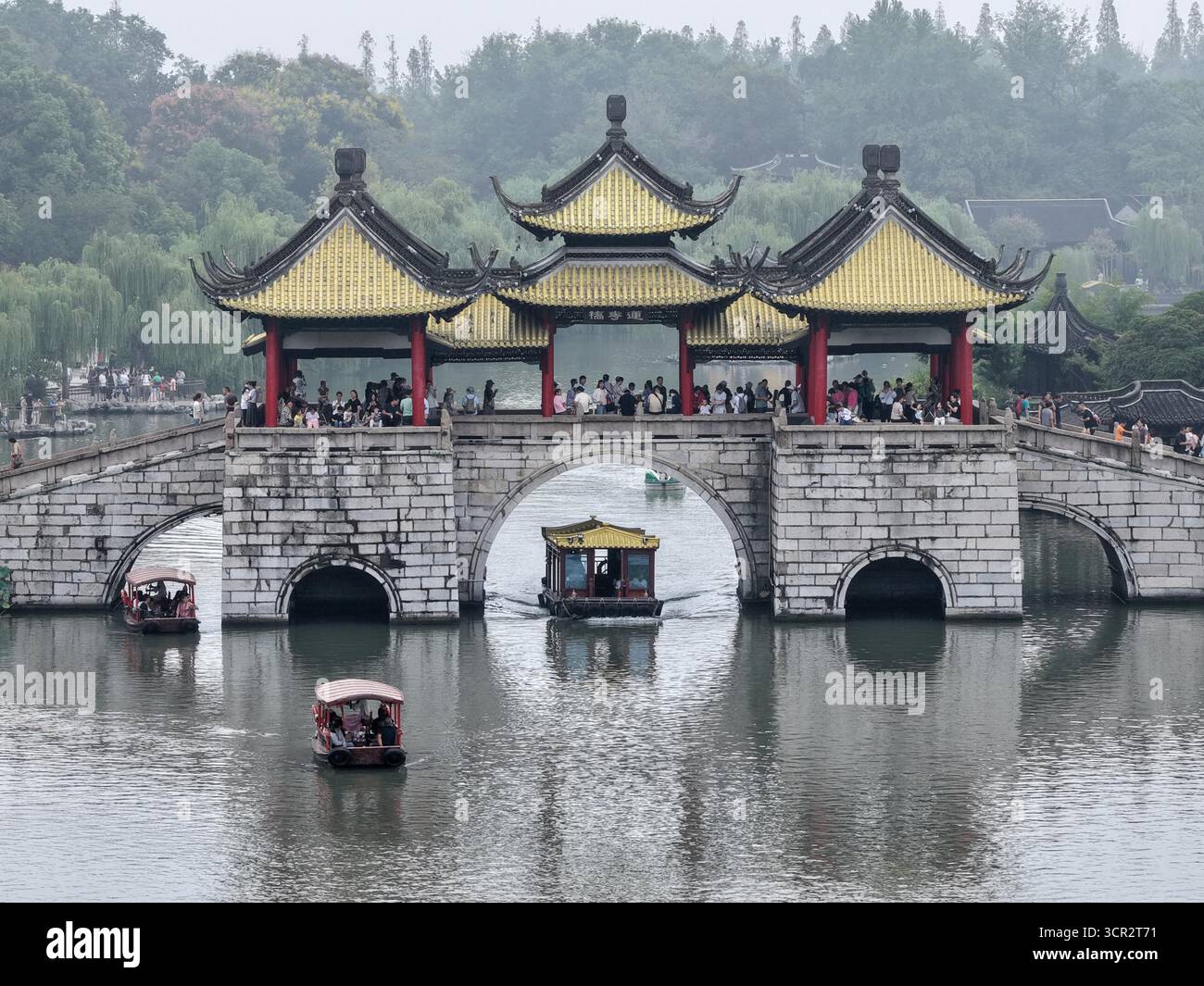 Aerial photo shows tourists visiting the Slender West Lake scenic area ...