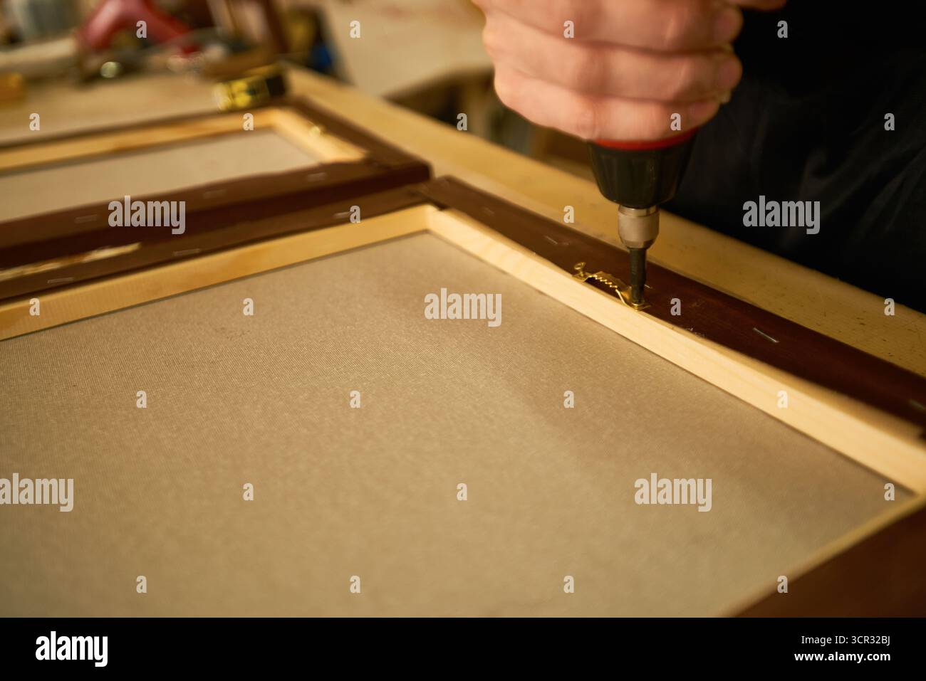Man assembling wooden frame hi-res stock photography and images - Alamy