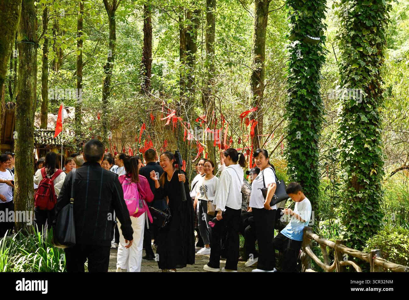Tourists visit the Taohuayuan scenic area in Youyang County, Chongqing ...