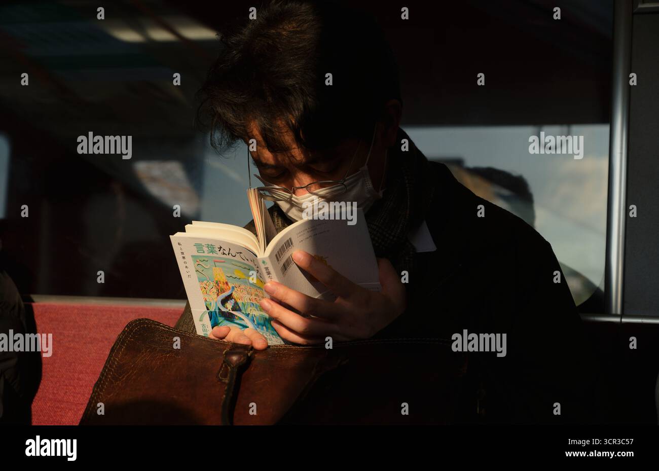 Contemplative man sits train hi-res stock photography and images - Alamy