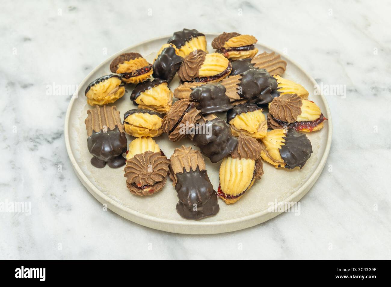 Modern tea pastries with shortbread decorated with royal icing in ...