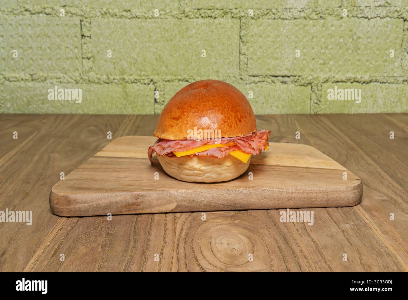 Gourmet burger with a secret blend of meats, melted smoked Gouda cheese ...