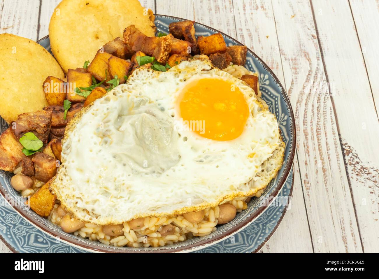 Wheat cuchuco with pork backbone, fava beans, and peas, thick and ...