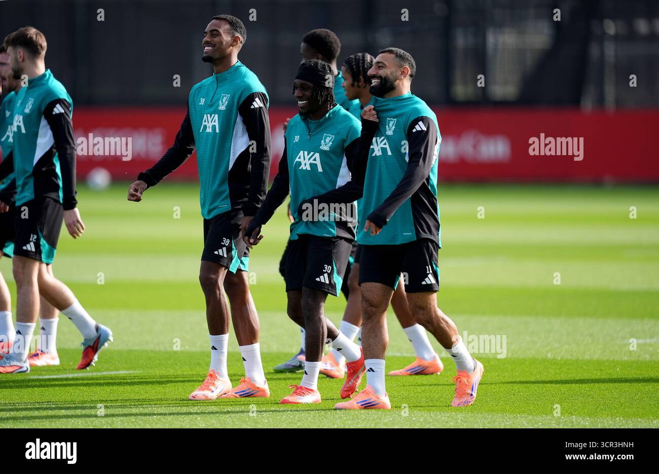 Liverpool's Jeremie Frimpong, Mohamed Salah (right) and Ryan ...