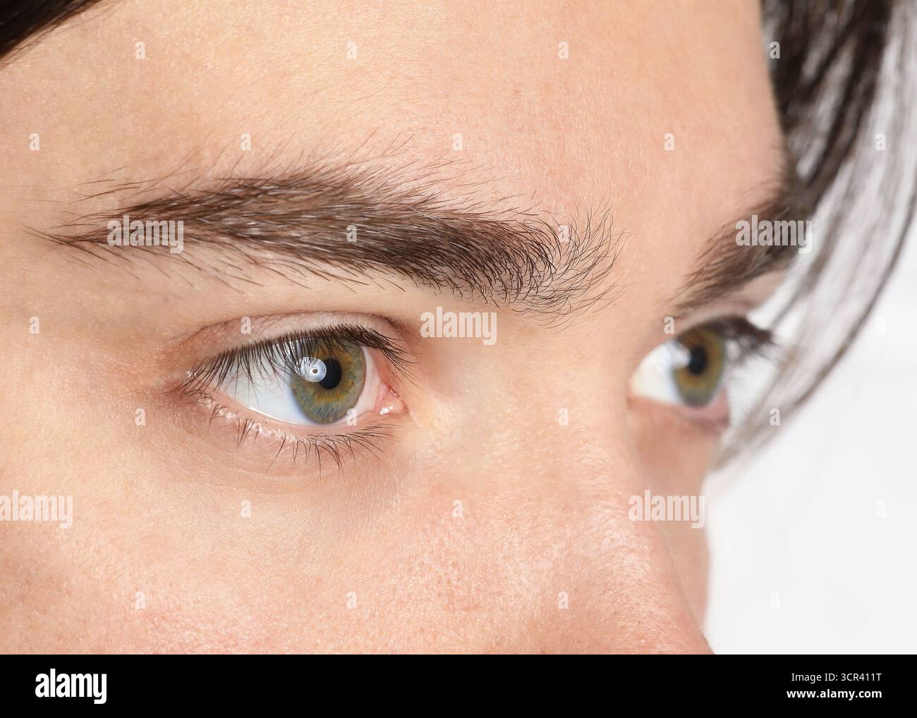 Man with beautiful eyes on light background, closeup Stock Photo - Alamy