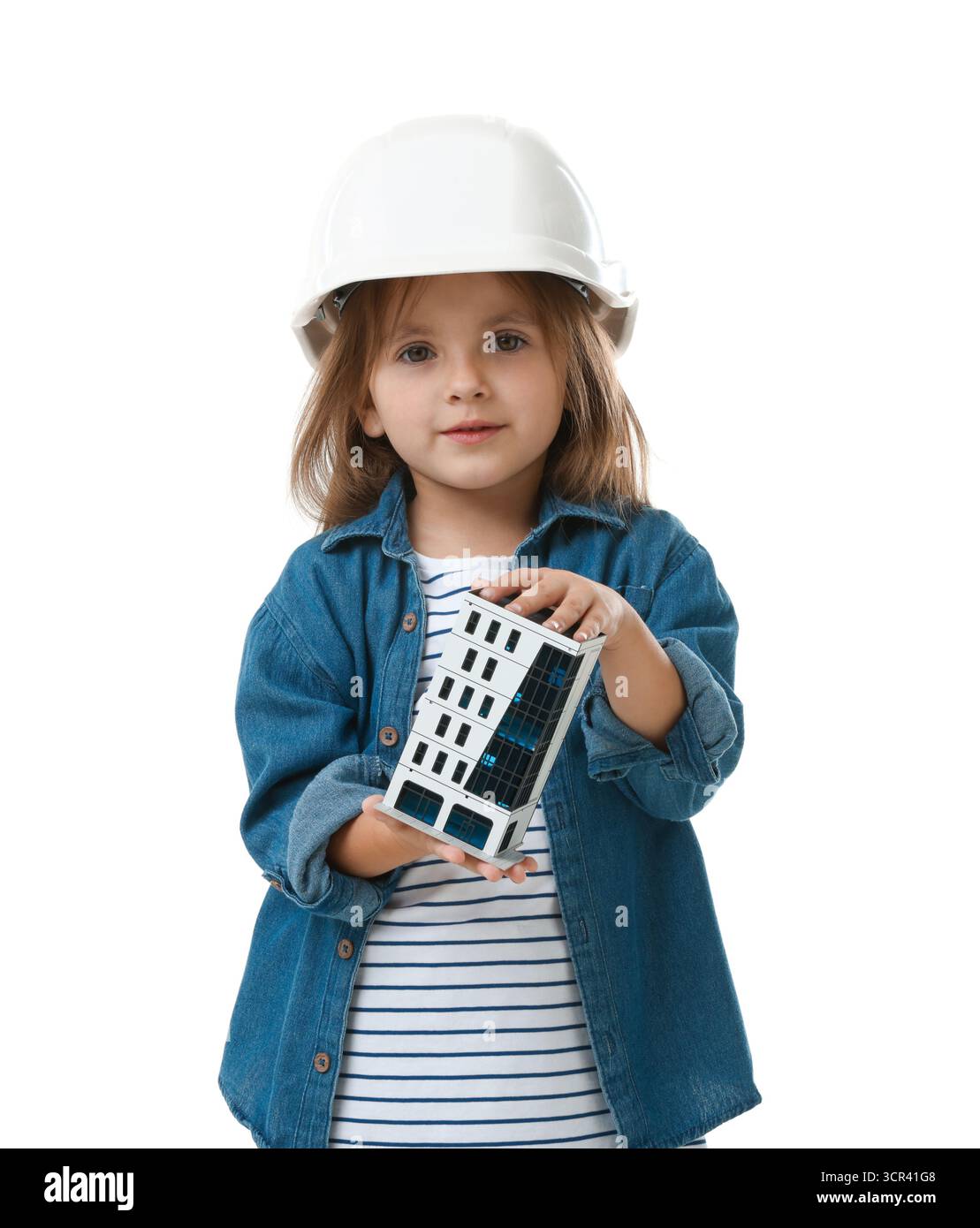Choice of profession. Little girl in hardhat with building model ...