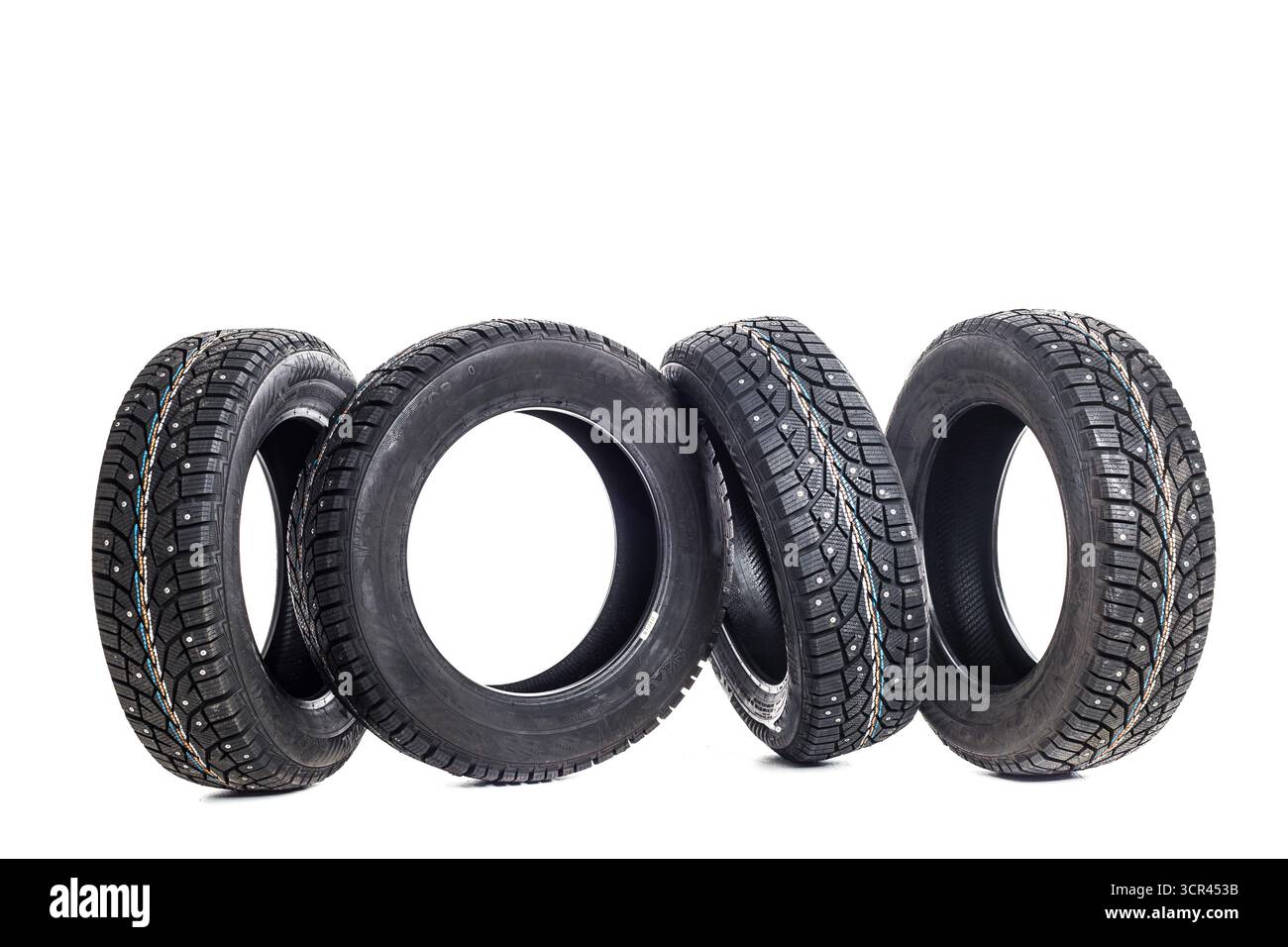 Different types of car tires displayed in a row on a white background ...