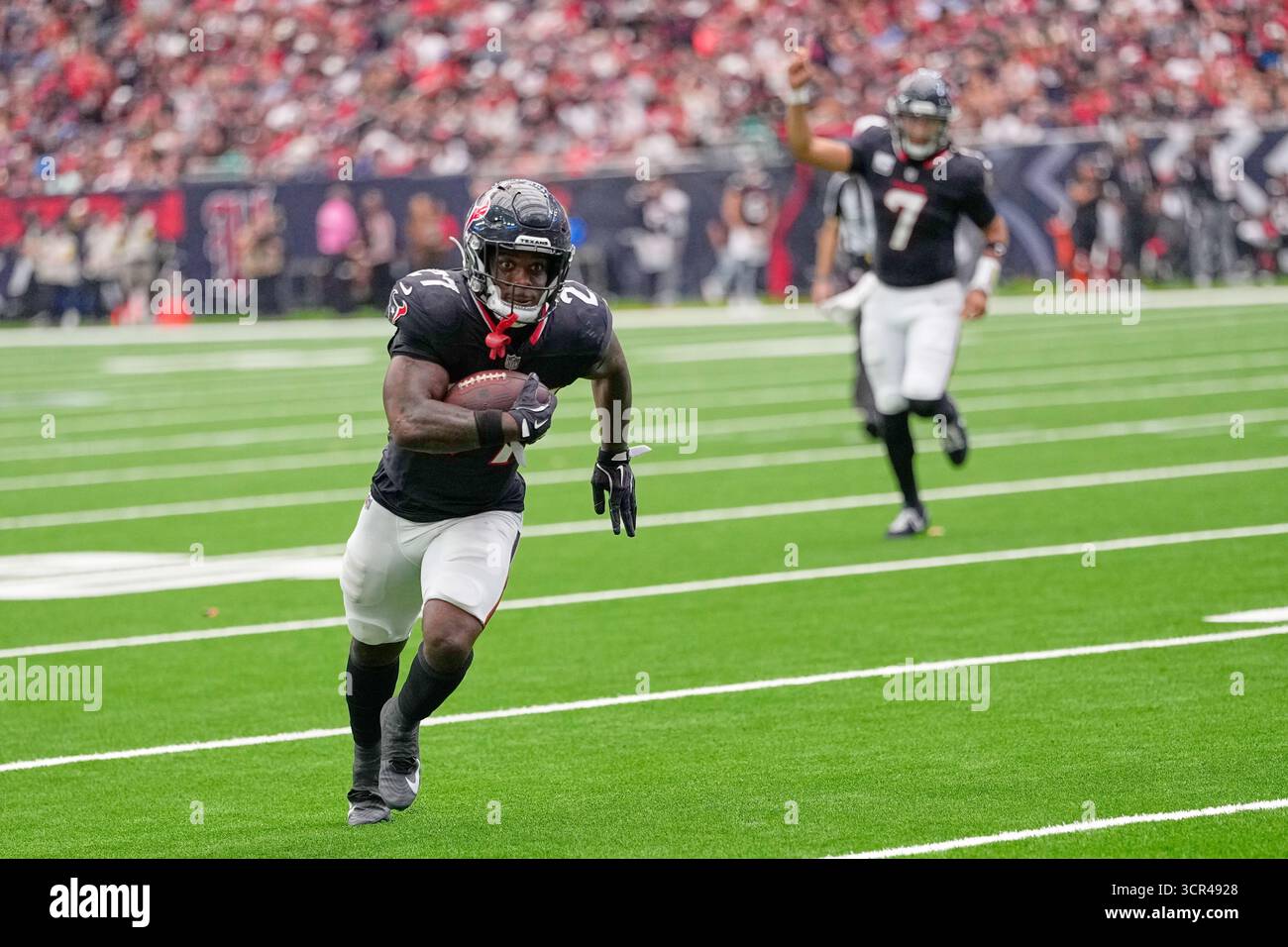 Houston Texans running back Woody Marks (27) rushes for a touchdown ...