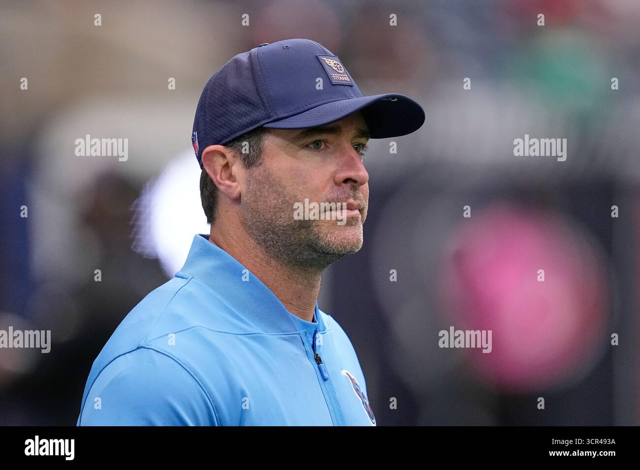Tennessee Titans coach Brian Callahan watches players stretch before an ...