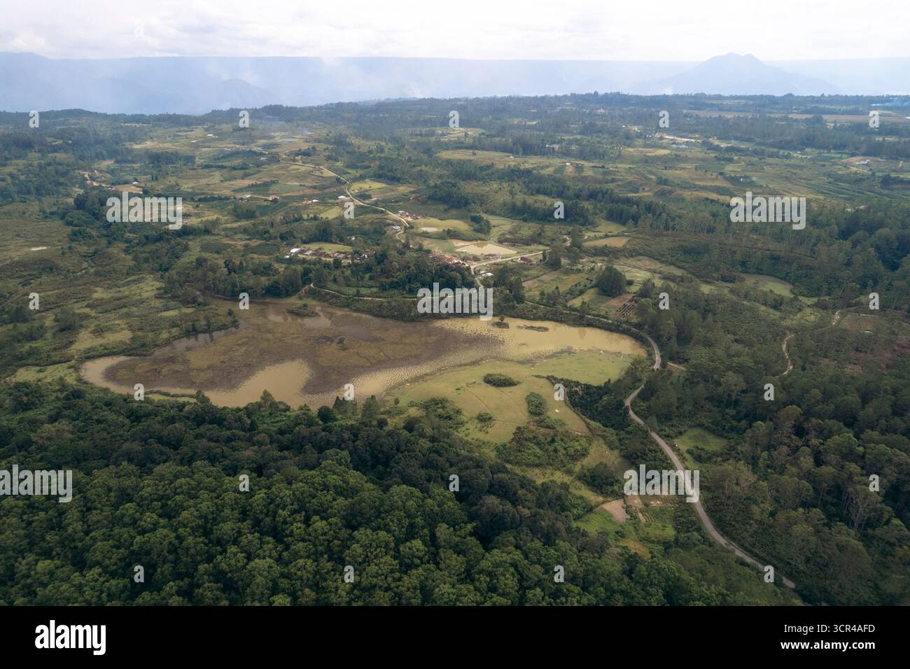 Aerial view of Samosir island in the middle of the biggest caldera in ...