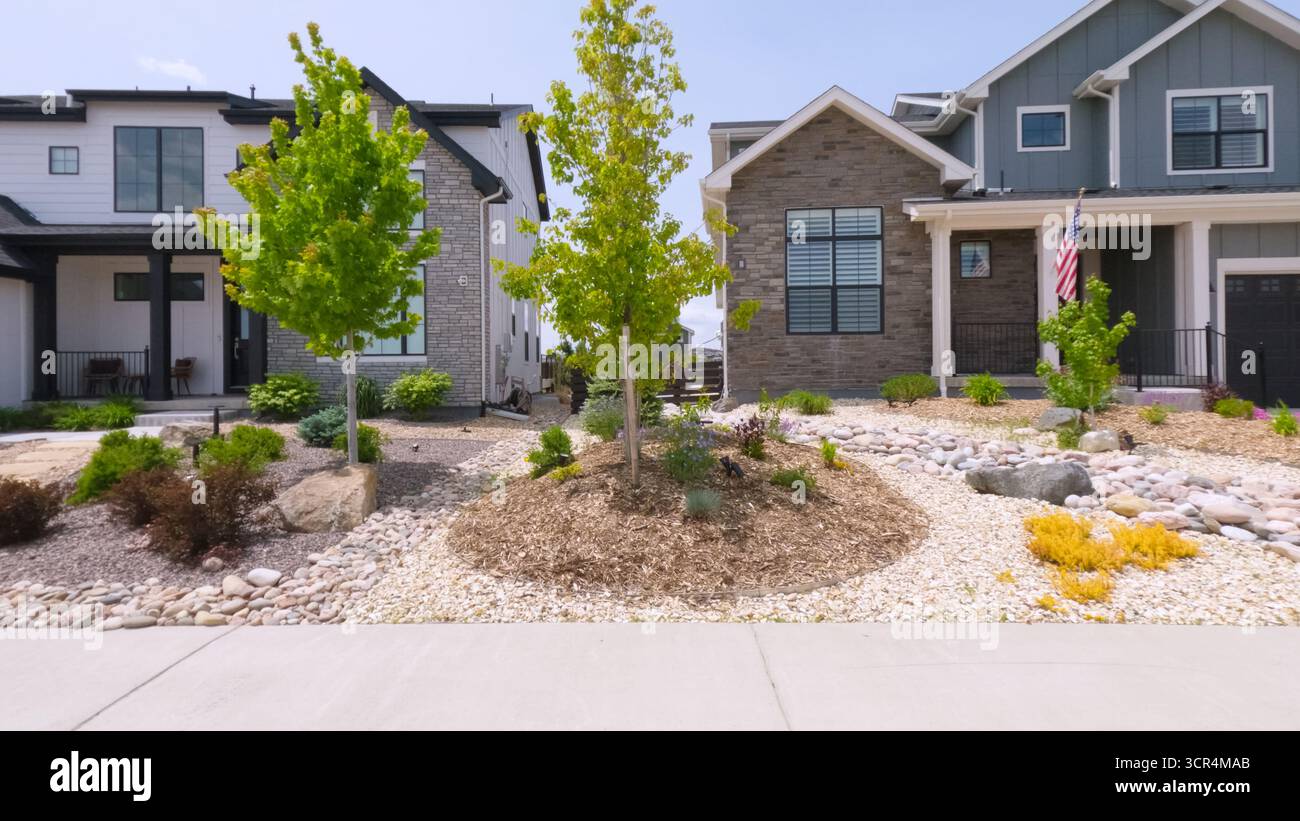 Suburban House With Trees and Mulch Bed Stock Photo - Alamy