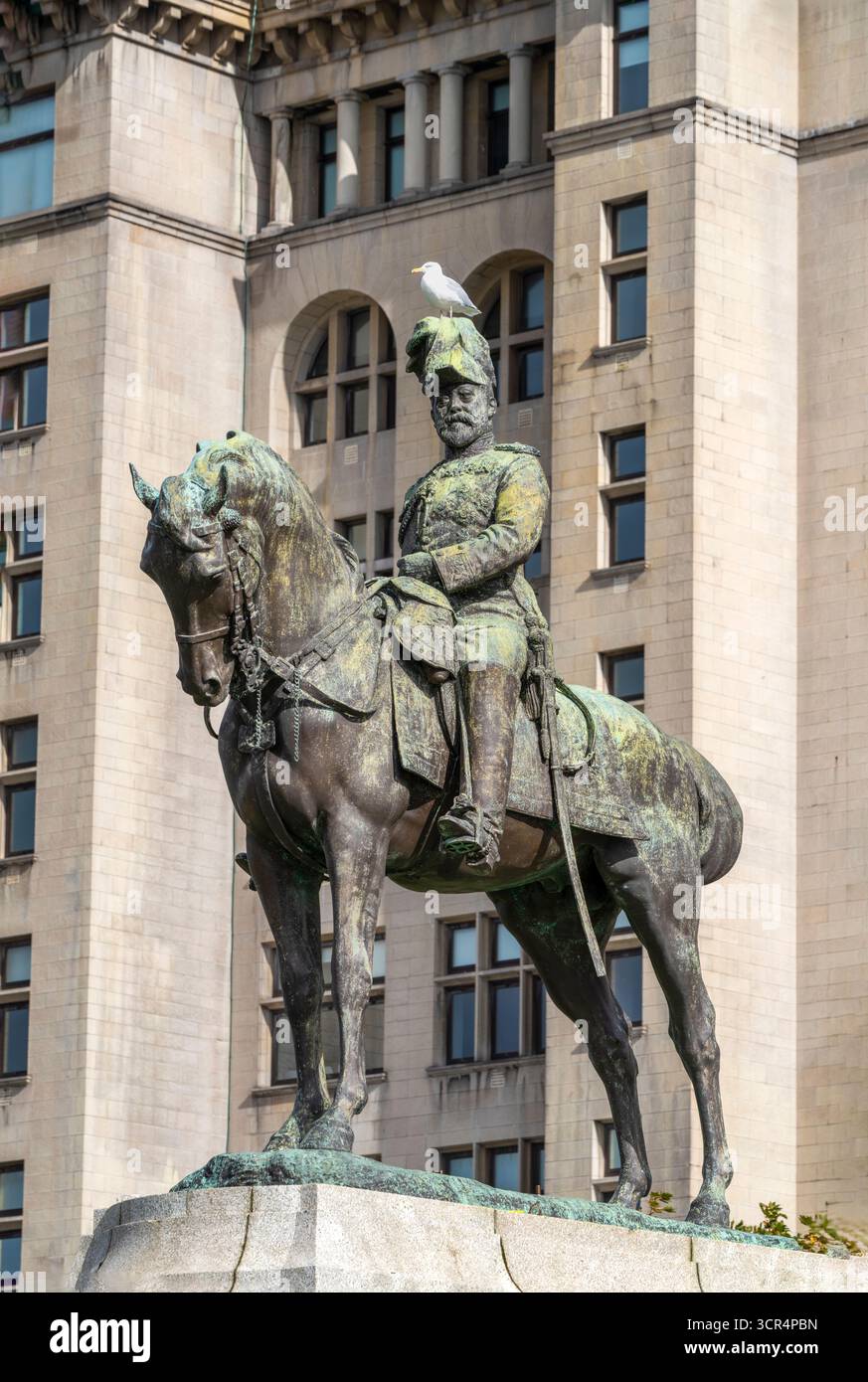 A bronze statue of King Edward VII on horesback, on a plinth ...