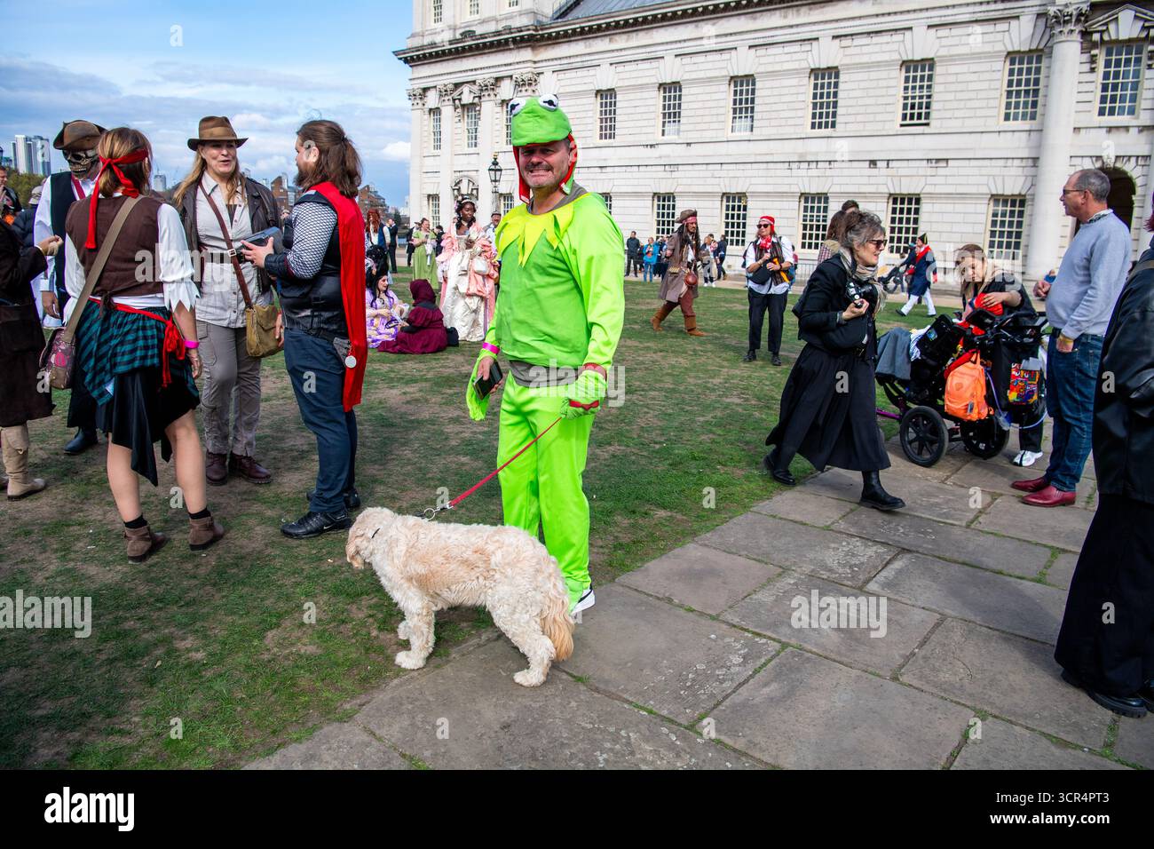 Crowds in costume gather at the Old Royal Naval College, setting a ...